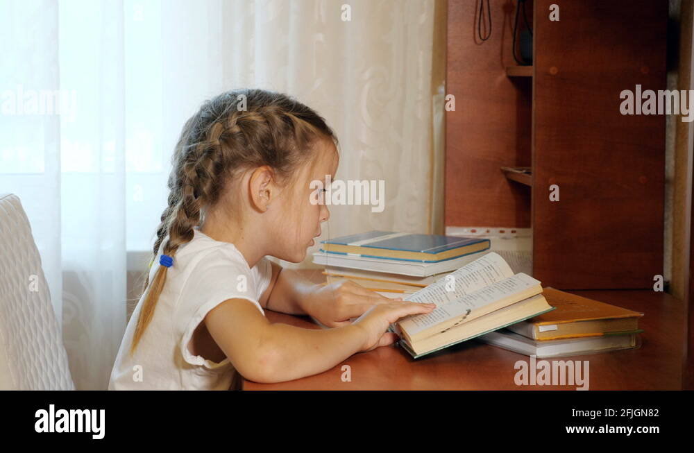Girl reading book desk table Stock Videos & Footage - HD and 4K Video ...