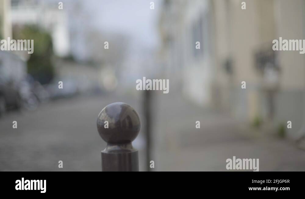A focus pull of a typical cobblestone street scene in the Montmartre ...