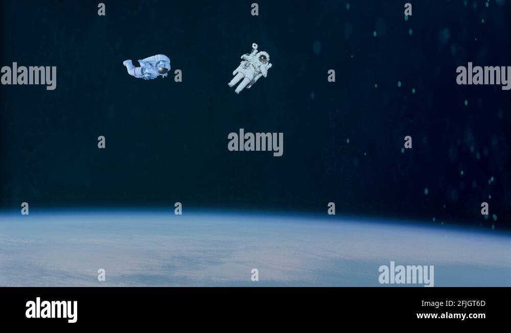 Astronaut floating around in space above earth Stock Video Footage - Alamy