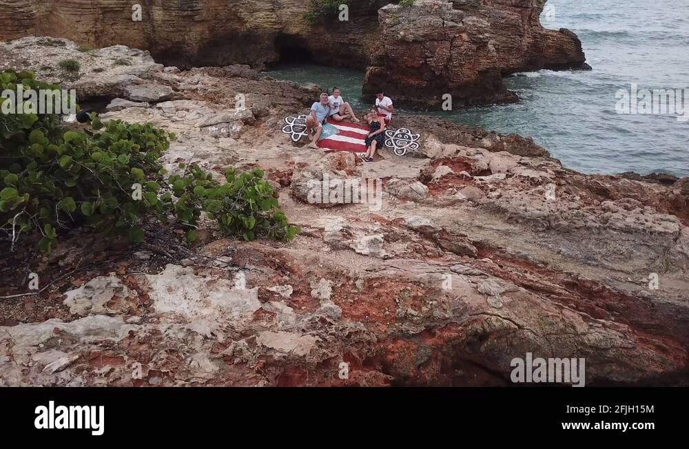 Lifting up and backing away from an anonymous group of people sitting ...