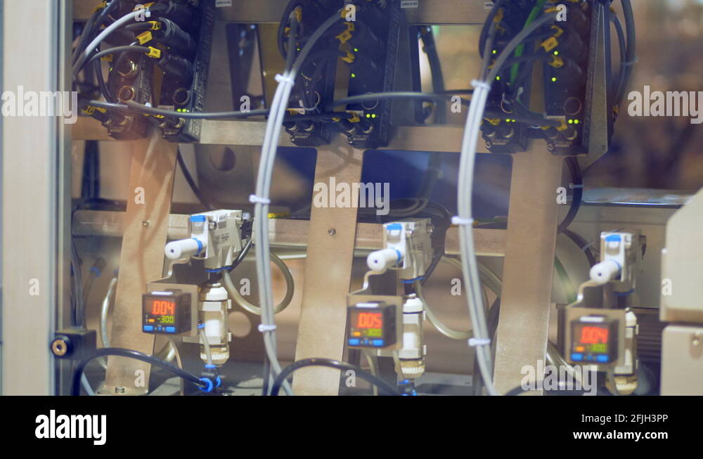 Close up of an industrial machine moving back and forth in a modern ...