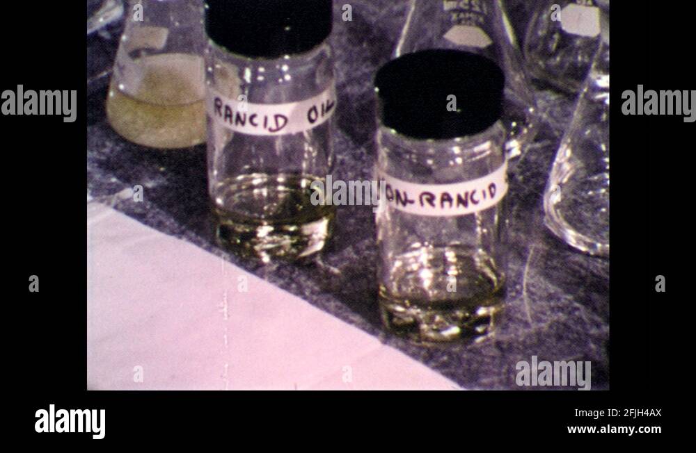 1960s: Chemistry lab, samples of rancid and non-rancid oil, woman in ...