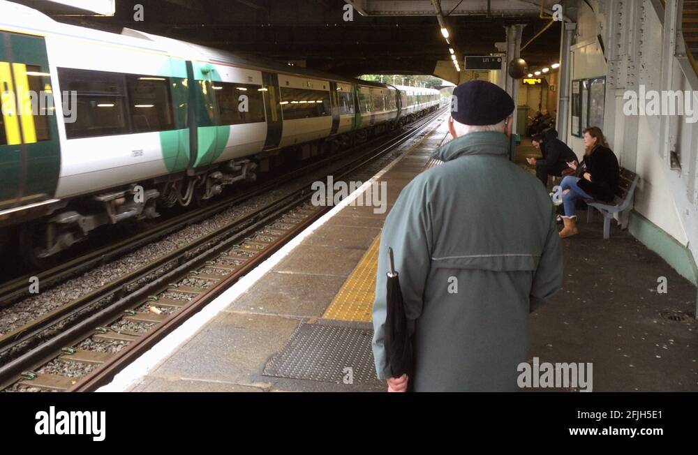 Man waiting train uk Stock Videos & Footage - HD and 4K Video Clips - Alamy