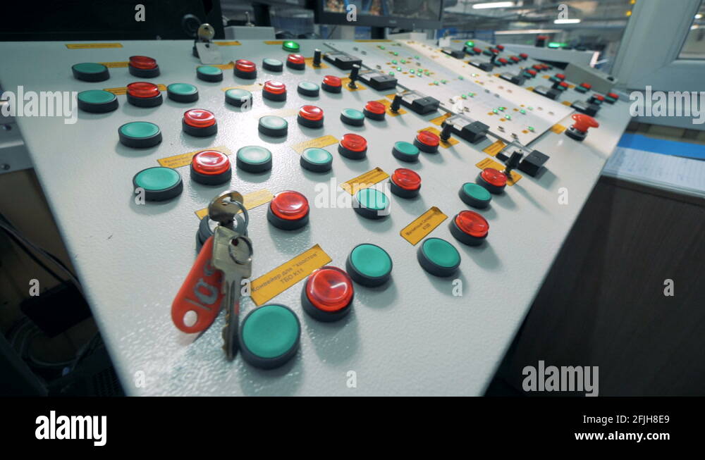 A dashboard in a control room. Special board with buttons is in a ...