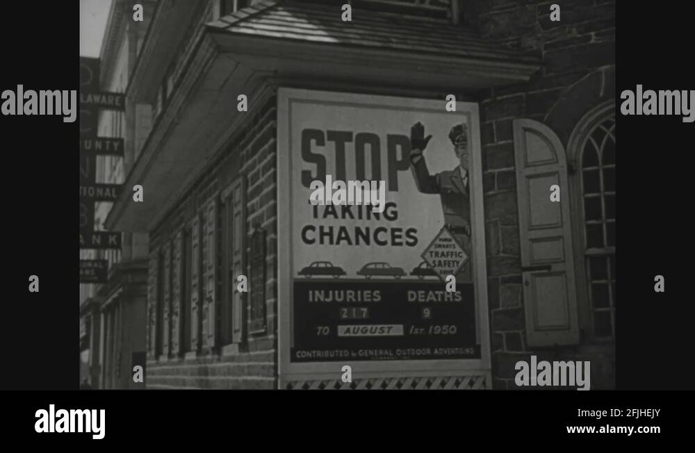 Scenes of safety signs and worker set up signal light on pole - 1950 ...