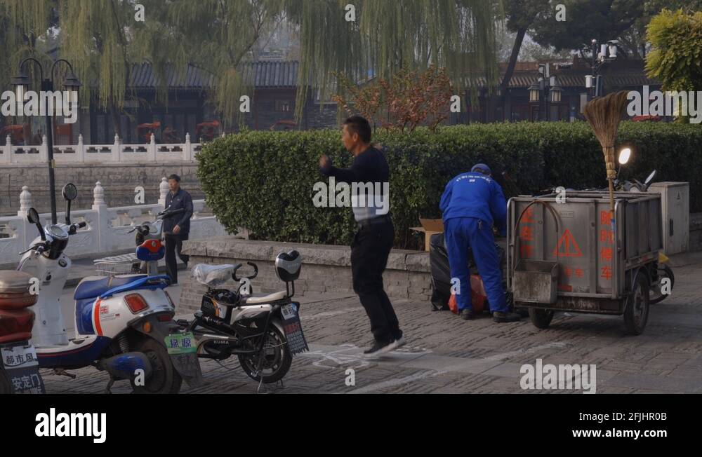 Bustling Beijing public city street with locals and multiple ,odes of ...