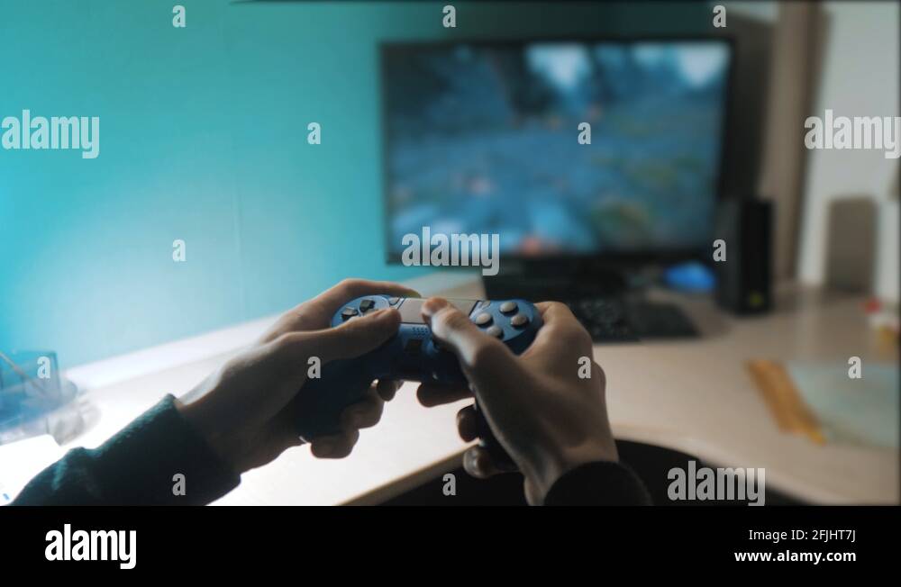 boy is playing on controller joystick gamepad the console computer ...