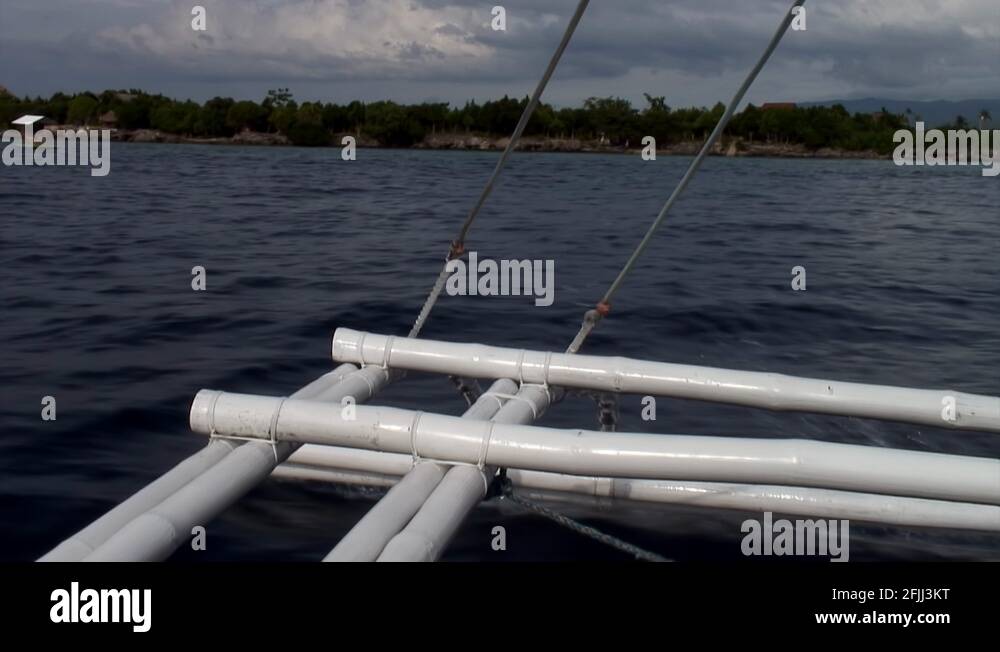Bamboo wings of philippine boat on background of sea on Philippines ...
