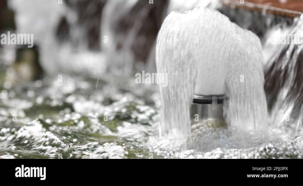 Water bubbling from a fountain Stock Video Footage - Alamy