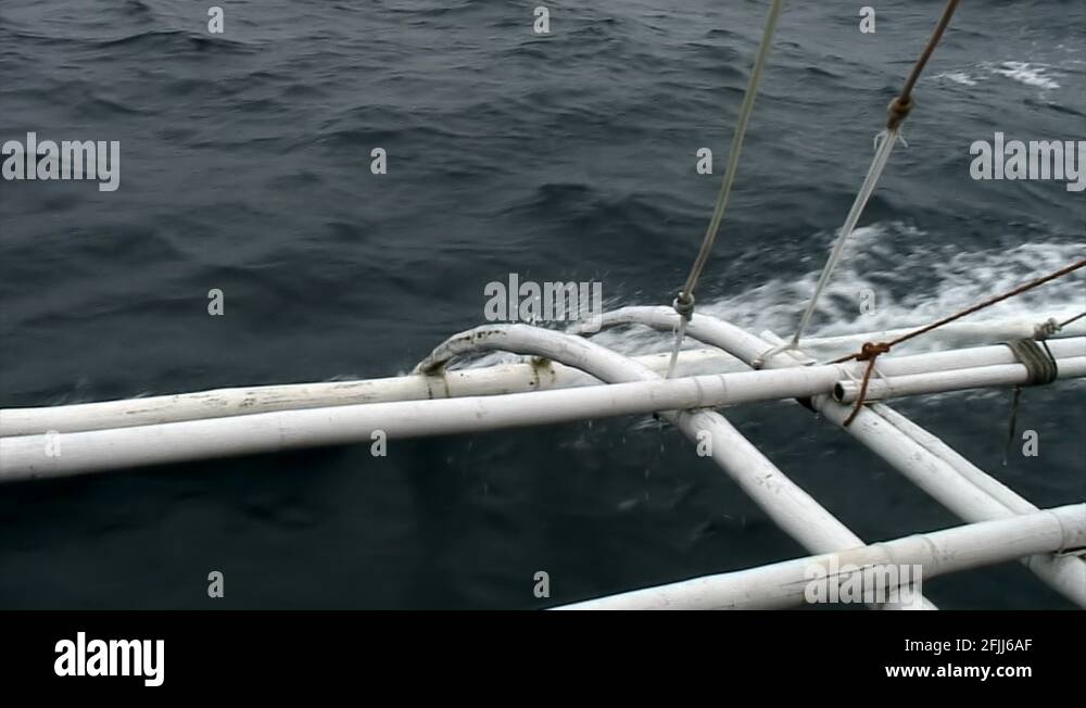 Bamboo wings of philippine boat in sea on islands of Republic of ...