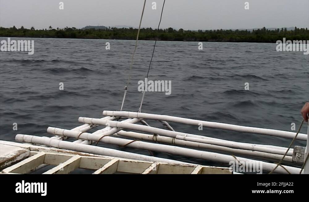 Bamboo wings of philippine boat in sea on islands of Republic of ...