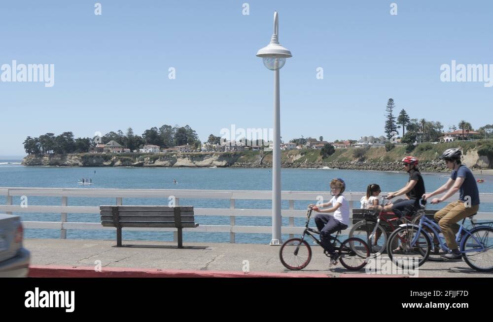 People and cars on Municipal Wharf and beach, Santa Cruz, California ...