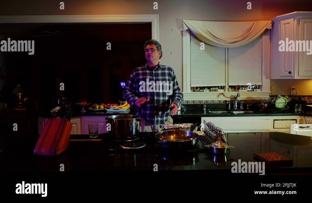 paranoid man looking out window Stock Video Footage - Alamy