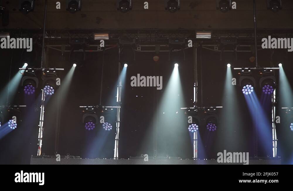Stage lights are turned on during the concert blinking and shining ...