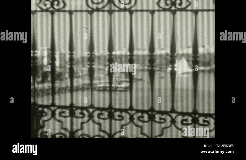 1920s: UNITED STATES: railings by port. View of harbour from boat ...