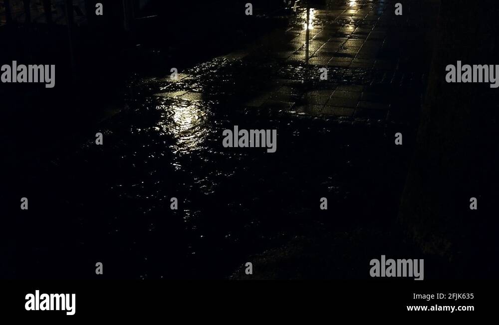 Rain puddle city Stock Videos & Footage - HD and 4K Video Clips - Alamy