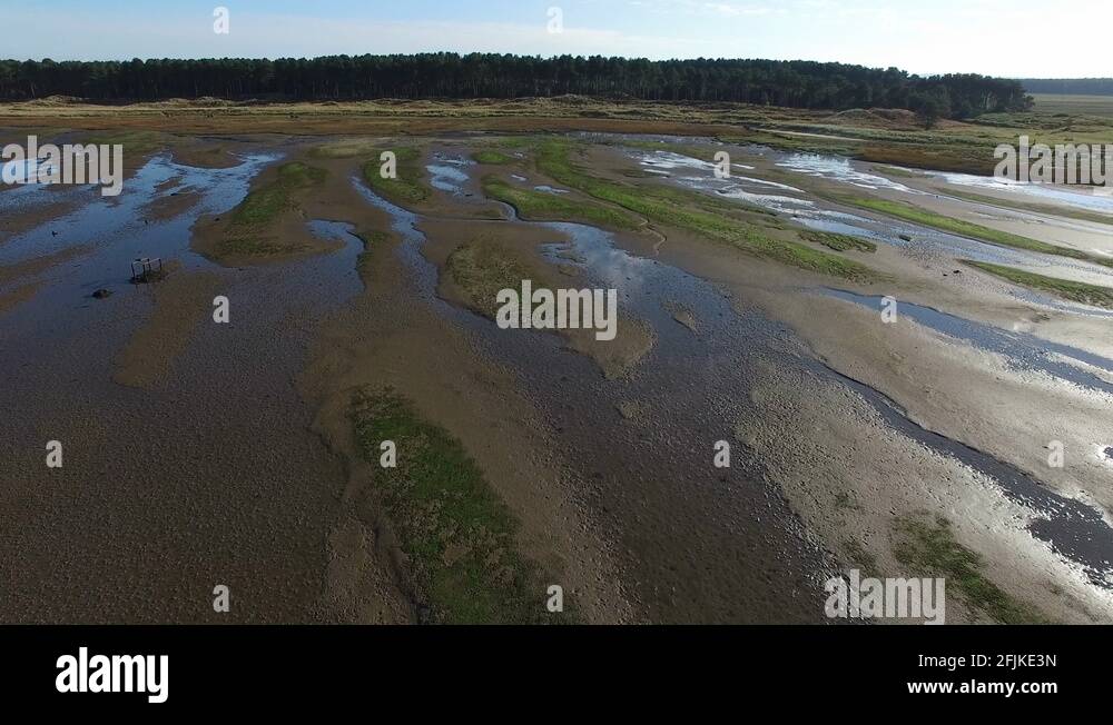 Drone footage of Scottish river estuary, beach, sandbanks and forest ...