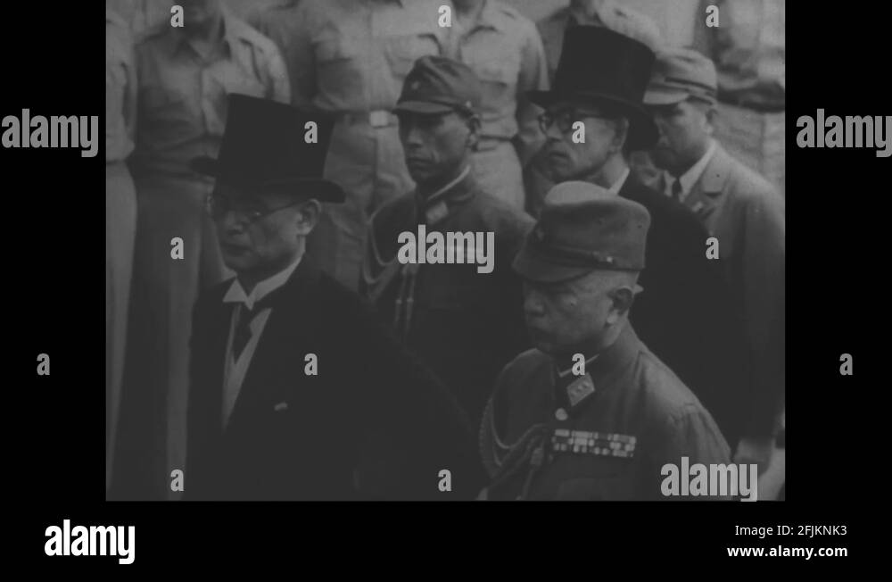 Gen. MacArthur at the Japanese surrender and officer signs documents ...