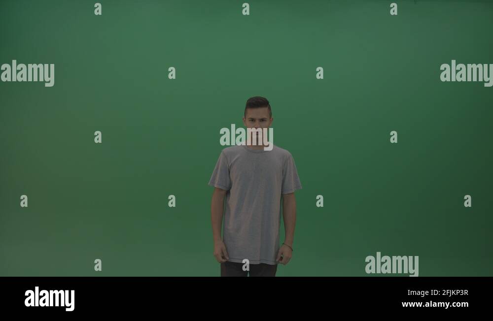 boy expresses himself over the green screen background Stock Video ...