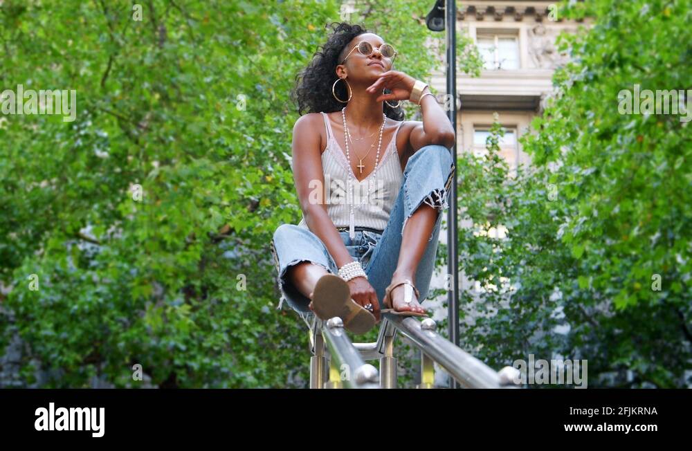 Woman sitting wearing jeans Stock Videos & Footage - HD and 4K Video ...