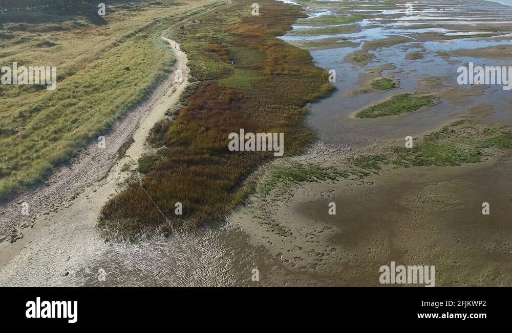 Drone footage of Scottish river estuary, beach, sandbanks and forest ...