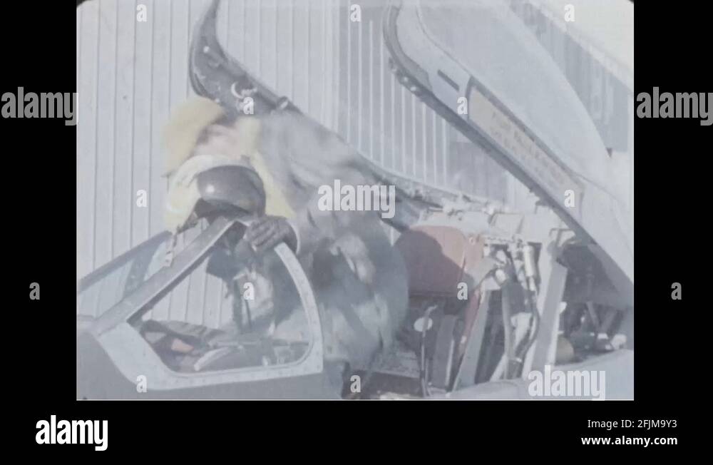 Jet pilot boards in jet plane, suits up and take off from airfield ...