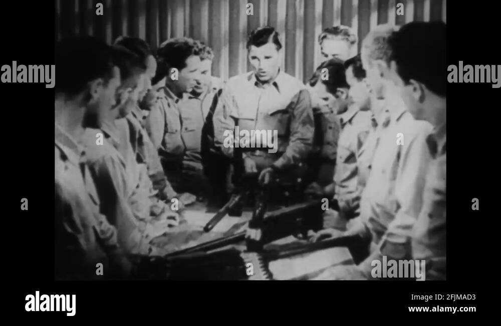 Instructor explains parts of machine gun to student gunners - 1943 ...