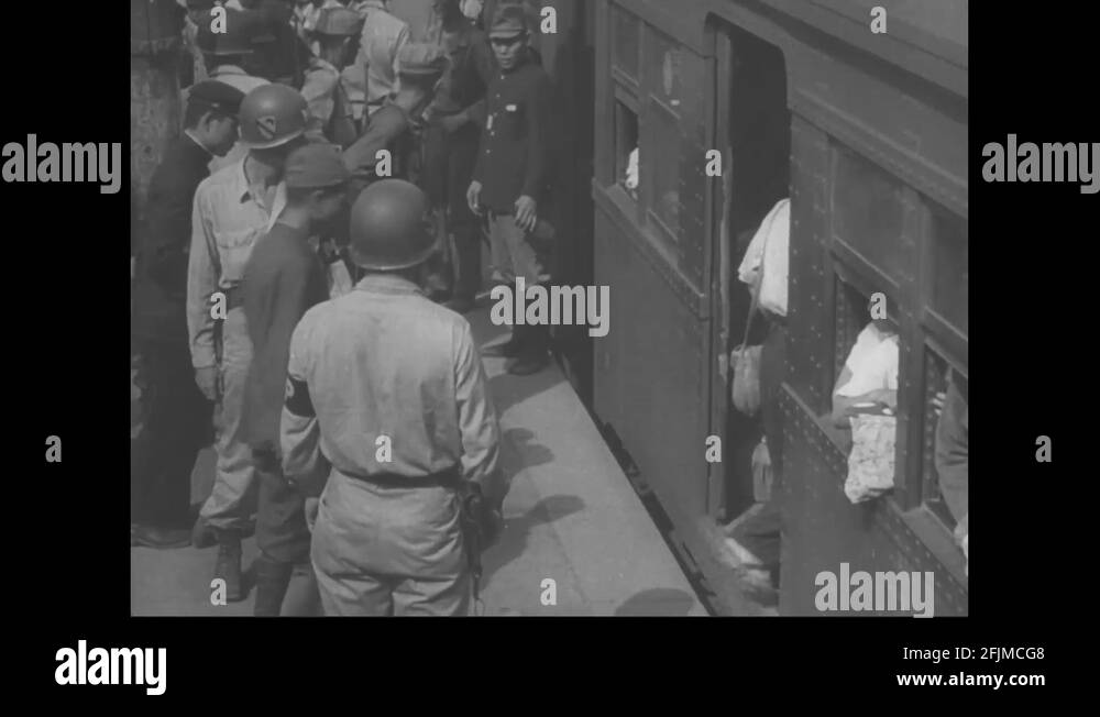 Japanese civilians board train and soldiers search a civilian, Japan ...