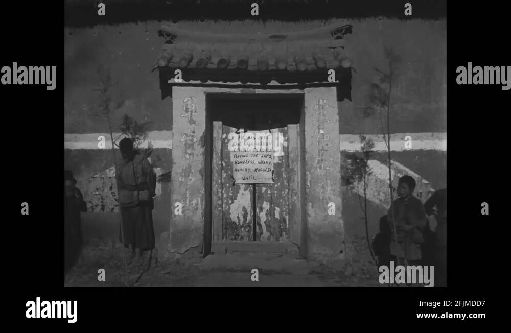 Chinese people stand and bullock cart pass through of the gate - 1944 ...