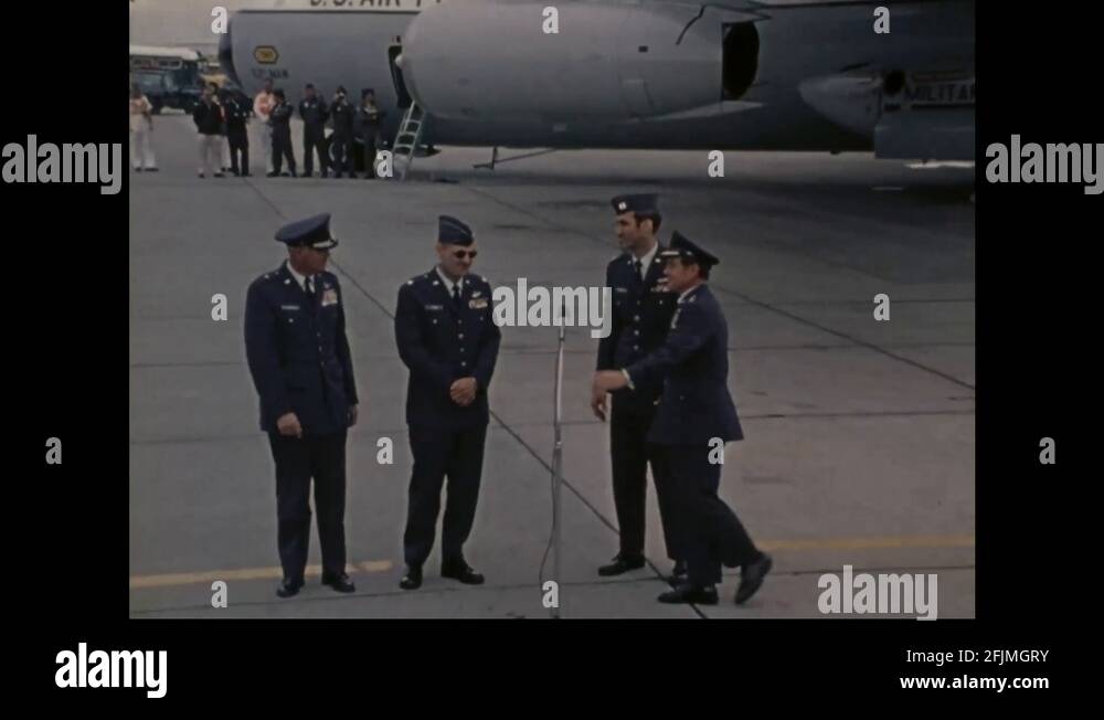 Lt. Robert L. Stirm and Carl Dennis Chambers speak to press at air base ...