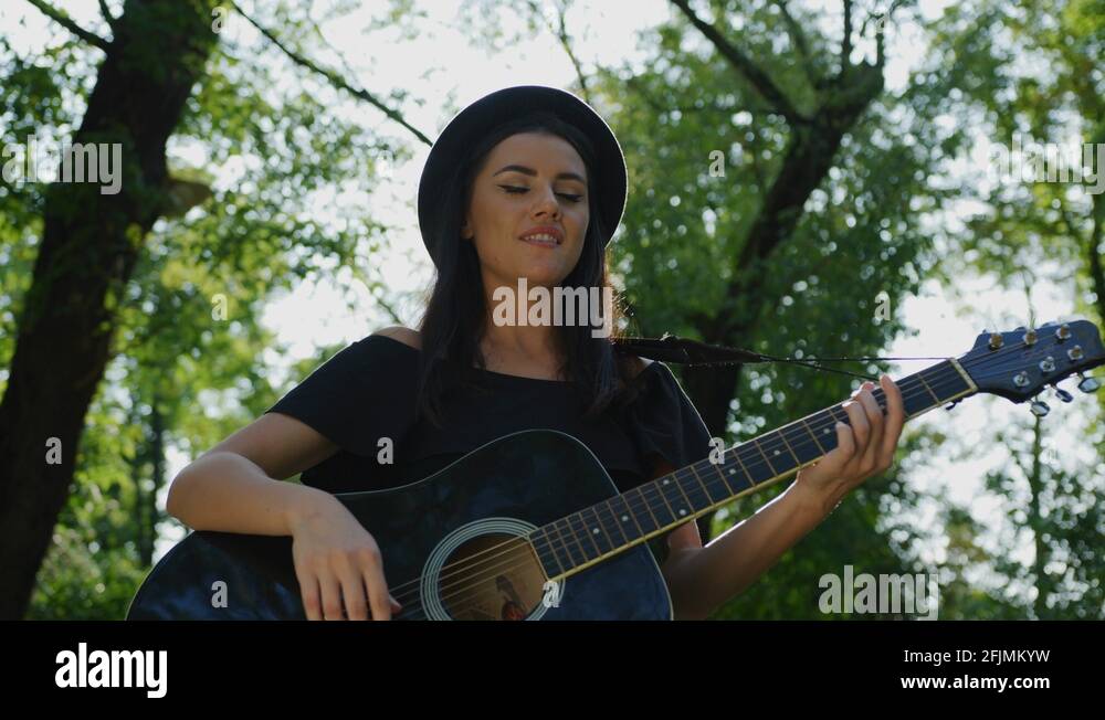Girl playing guitar Stock Videos & Footage - HD and 4K Video Clips - Alamy