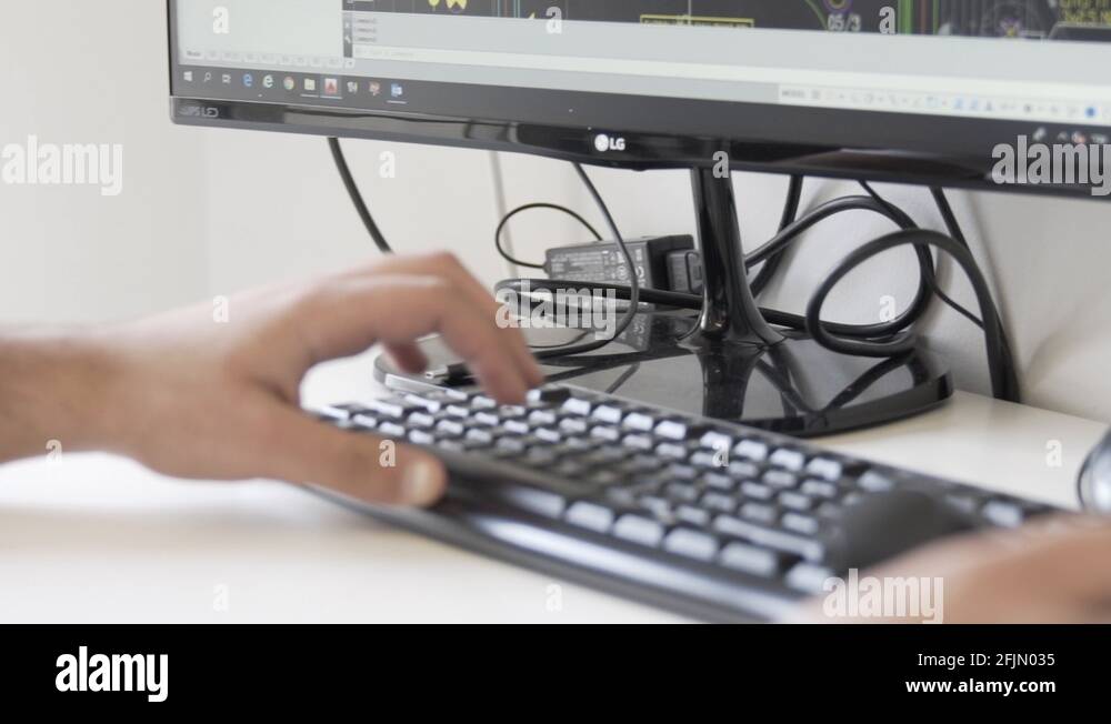 Typing on a keyboard. Man using mouse and typing on computer keyboard ...