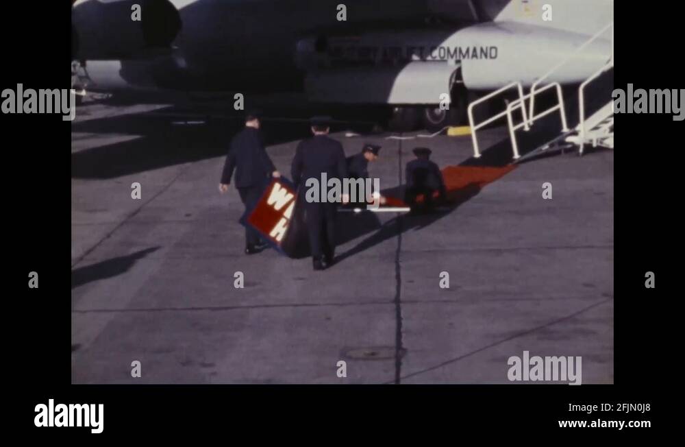 Officers place welcome mat at boarding ramp and crowds at Travis AFB ...
