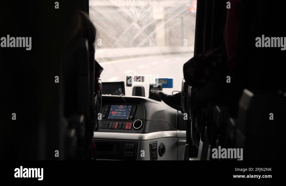 Close up footage of front windshield window of bus driving on highway ...