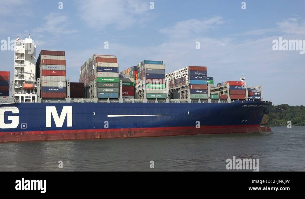 Huge container ship CMA CGM Benjamin Franklin entering Hamburg harbour ...