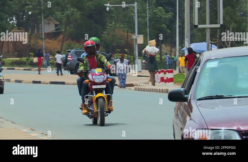 Moto taxis in Kigali, Rwanda Stock Video Footage - Alamy