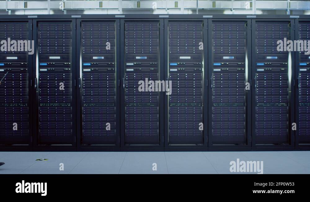 Black Data Center IT Technician Walk Through Server Rack Corridor with Laptop Stock Video ...