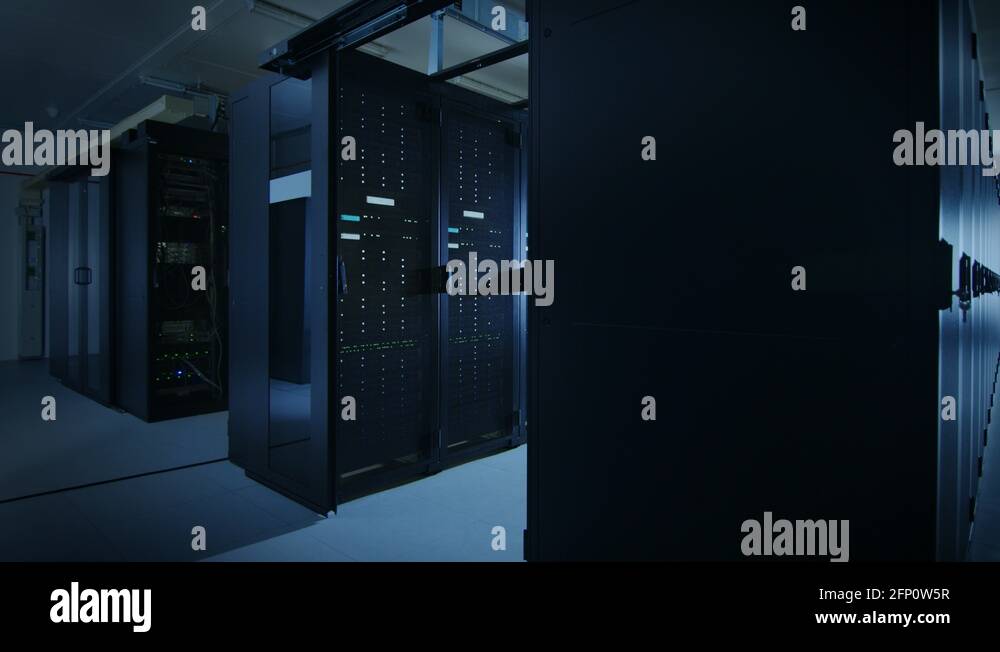 Camera Slide-Trough Shot of a Working Data Center With Rows of Rack ...