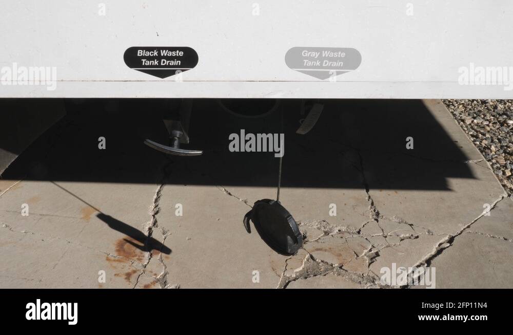 Black Waste and Gray Waste Tank Drain location on side of RV vehicle ...