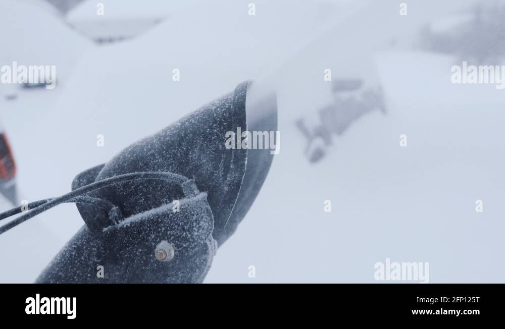 Snowblower shooting a snow in a heavy snow conditions. Snowblower shoot ...