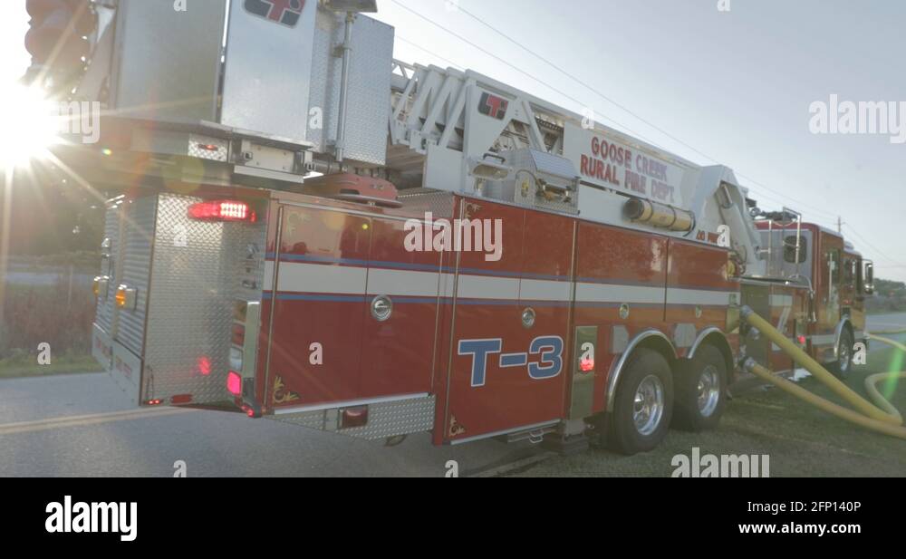Fire engine with fire hoses attached to a hydrant during emergency ...