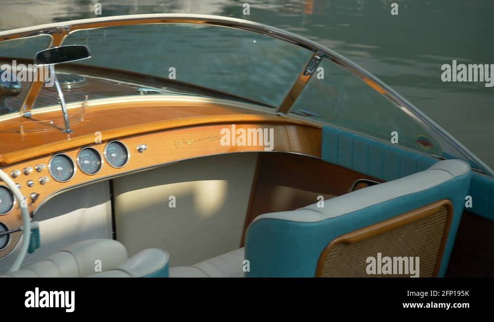 Detail of the dashboard on a classic luxury wooden runabout boat, slow ...