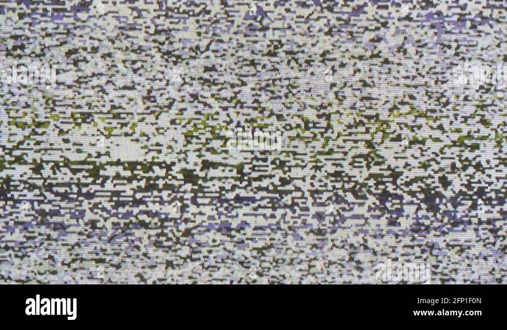 Close-up shot of loopable analog television static from an old TV ...