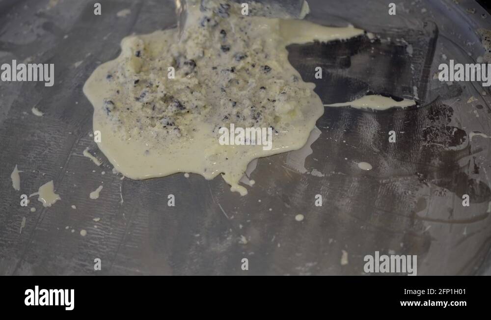 ice cream spread over a frozen mixing platform Stock Video Footage - Alamy