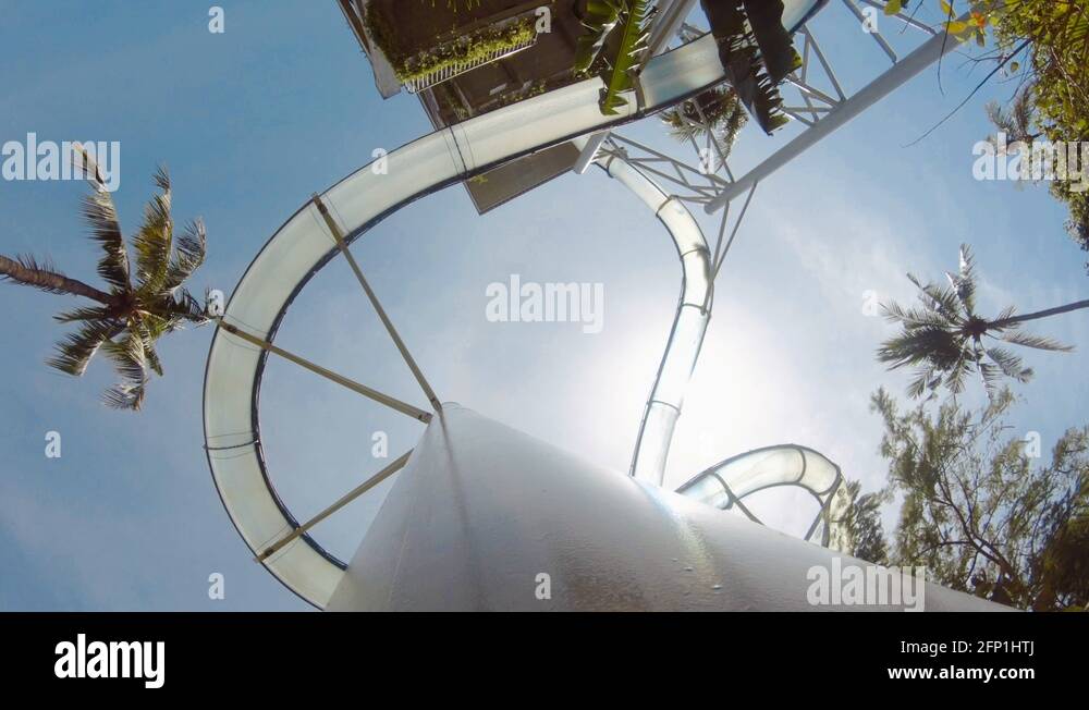 People Sliding Down in a Water Slide. Waterpark Summer Travel Activity ...
