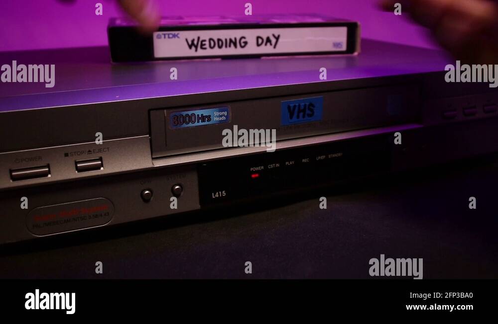 Inserting Wedding Day VHS Video Tape Into A VCR Player Stock Video ...