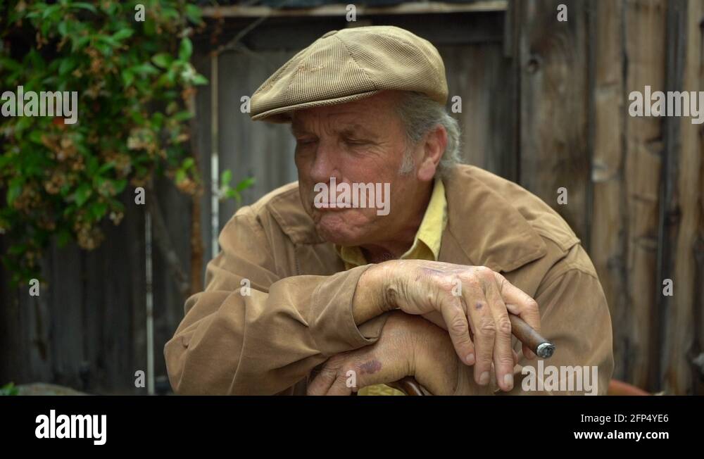 Hilarious funny character old man making faces and pouting. leaning on ...