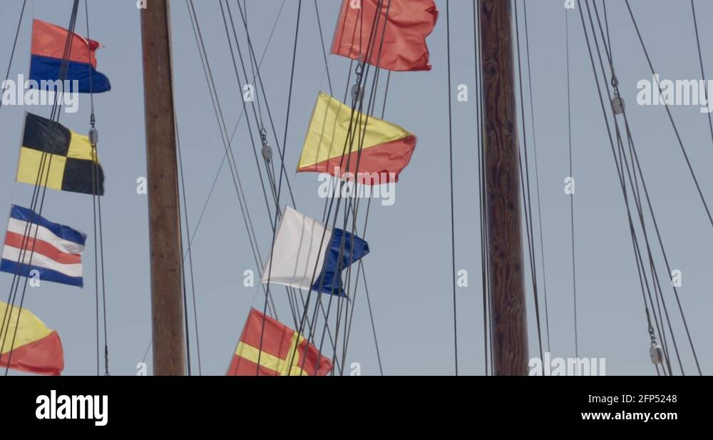 Nautical flags flying on a tall ship Stock Video Footage - Alamy