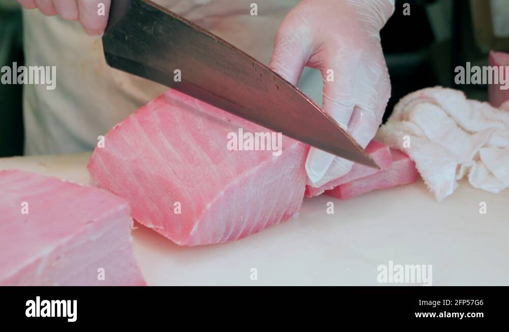Cutting Big Tuna Fish Meat Into Smaller Pieces With Big Knife Close Up ...