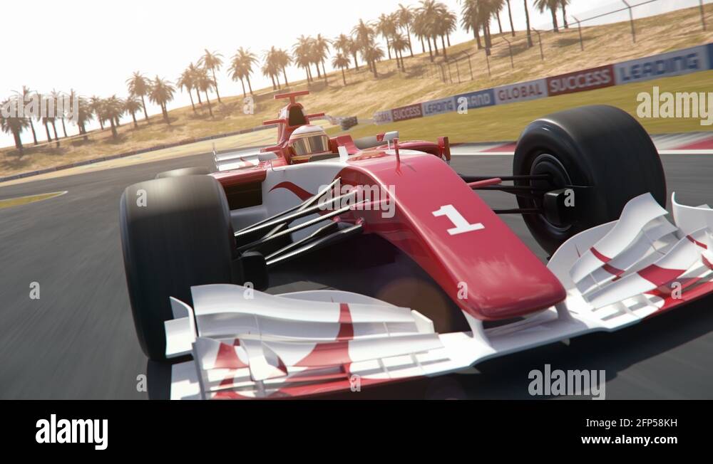 Formula one race car driving along race track - dynamic front view ...